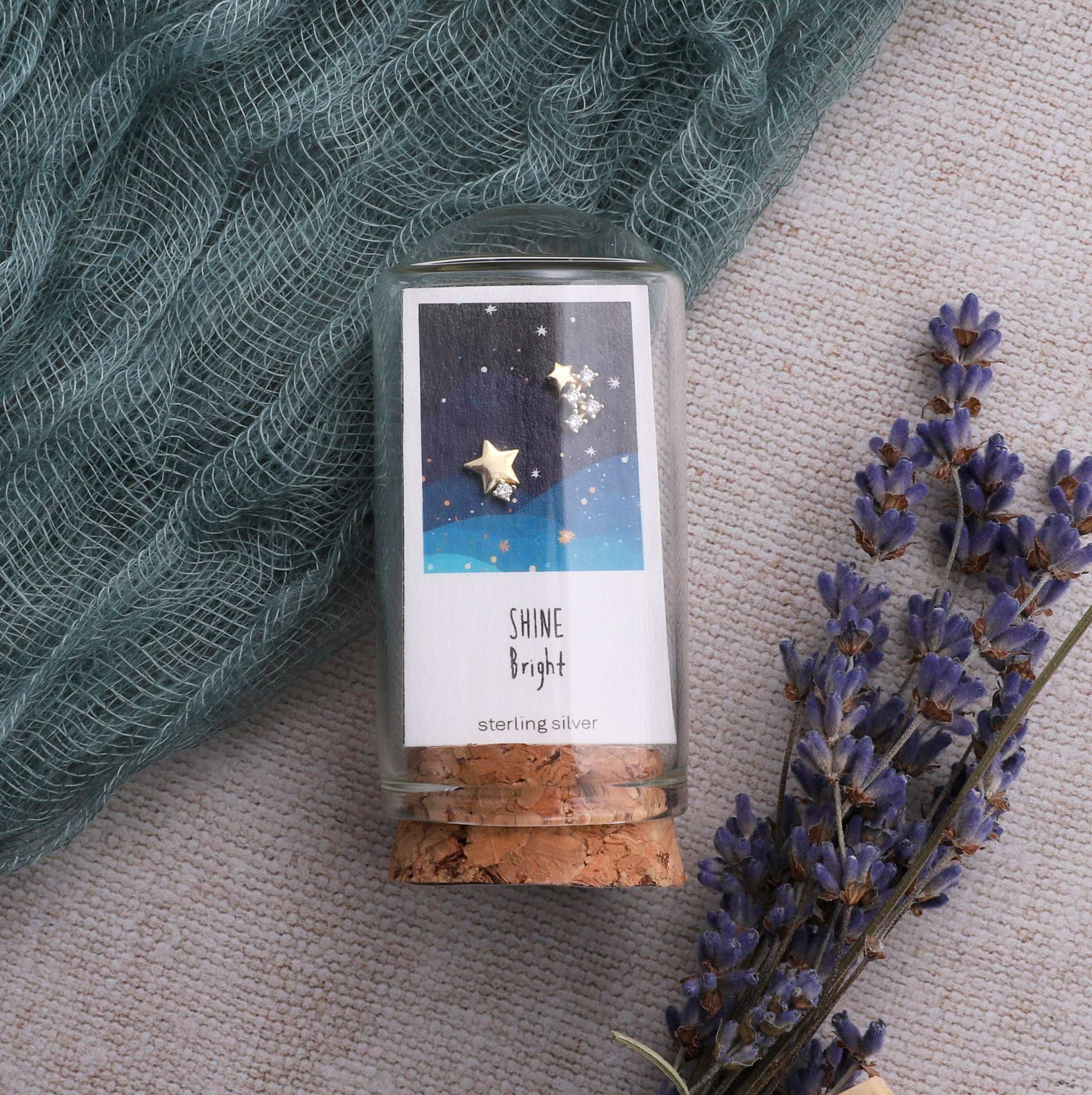 TT60062 'Shine bright' Asymetrical gold stars earrings in a bottle ...